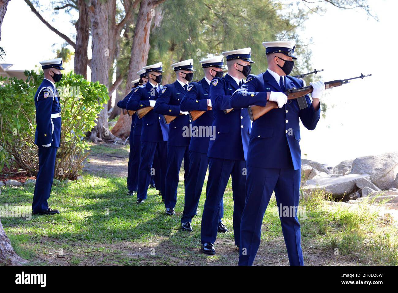 The Coast Guard Ceremonial Honor Guard provides a gun salute at the ...