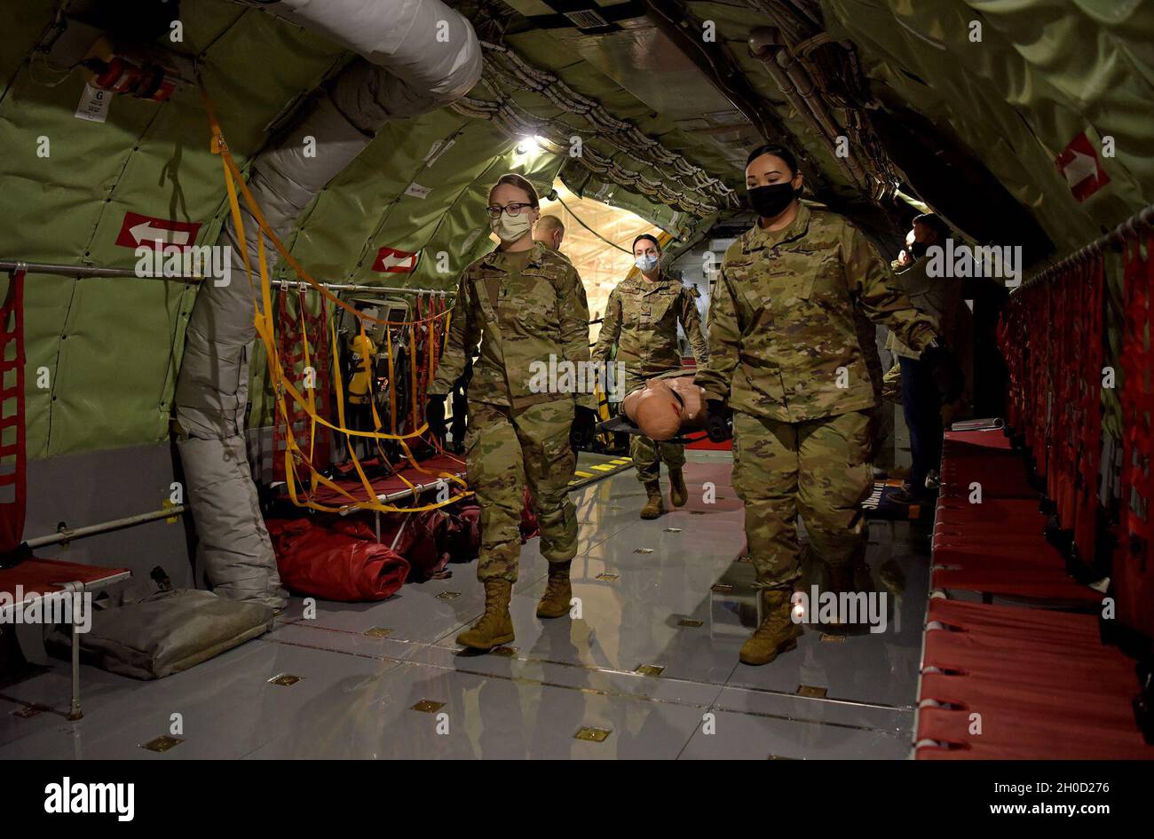 Medical technicians from the 375th Medical Group transport litters up a ...
