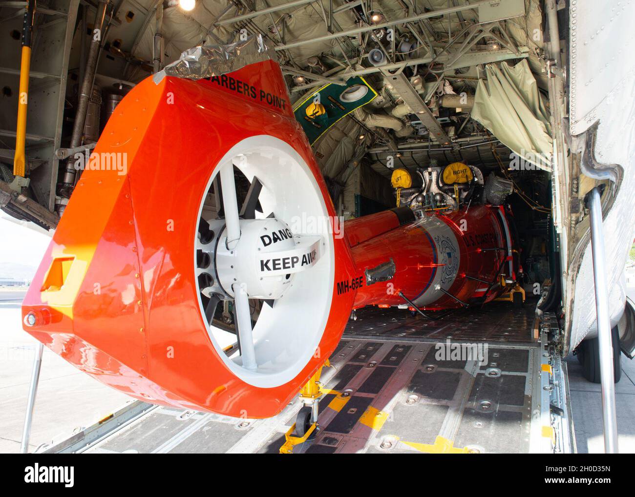 A Coast Guard Air Station Barbers Point MH-65E Dolphin helicopter ...
