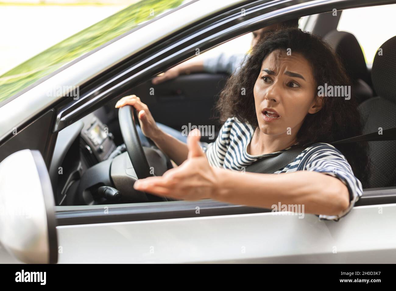 Indignant brunette lady driver fighting on the road Stock Photo - Alamy