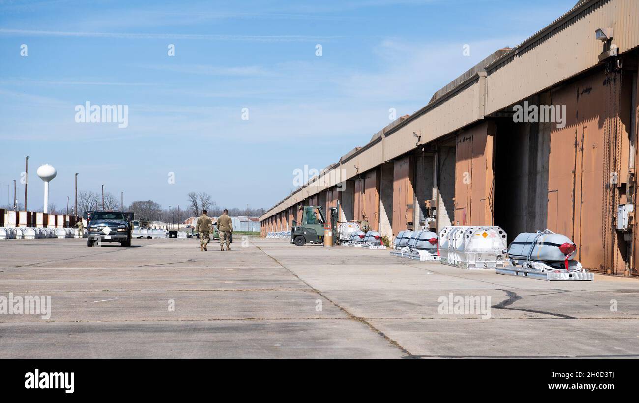 Airmen from the 2nd Munitions Squadron lay out AGM-158 Joint Air-to ...