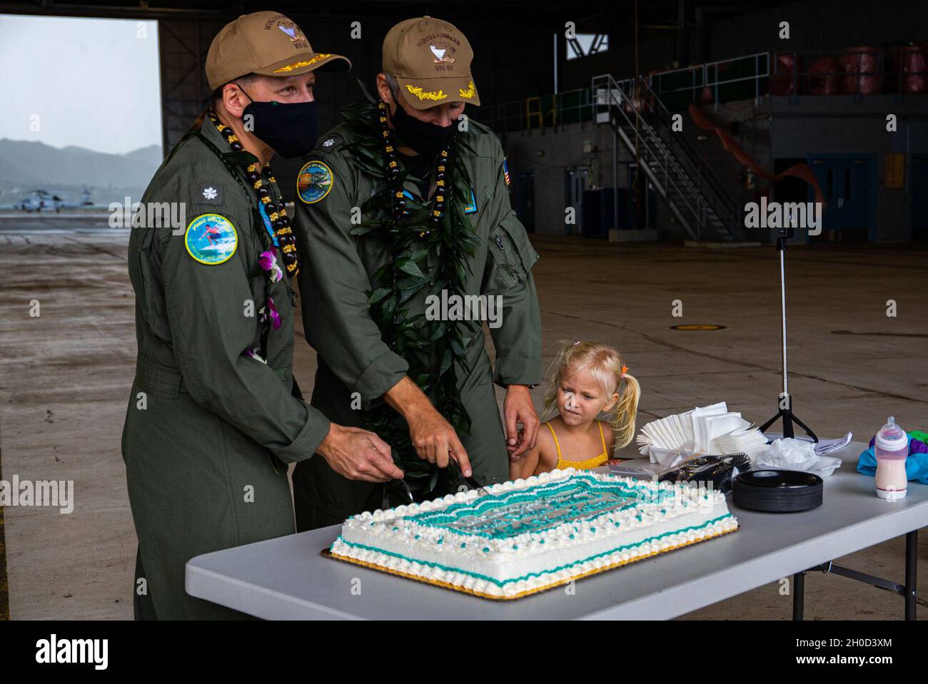 U.S. Navy Cmdr. Steven D. Hacker(left), off-going commander, U.S. Navy ...
