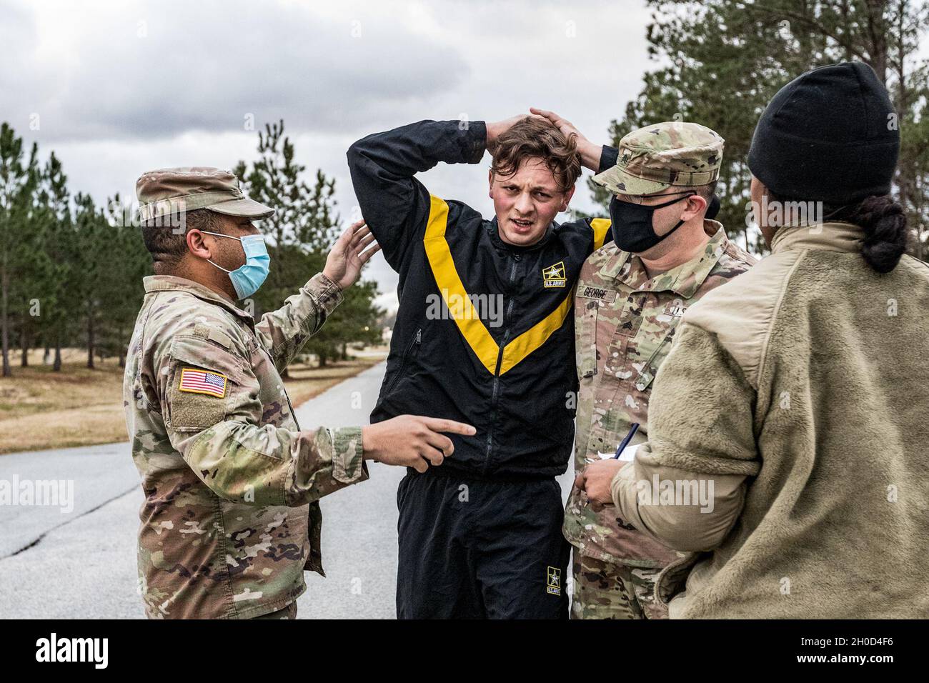 U.S. Army Pfc. Cody Watson, USARCENT, rests his hands on his head after ...