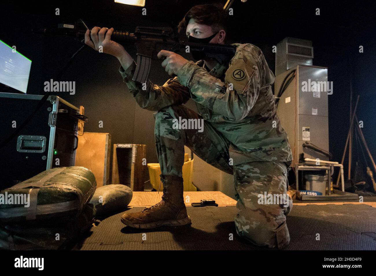 U.S. Army Pfc. Cody Watson, USARCENT, shooting his assault rifle on a ...