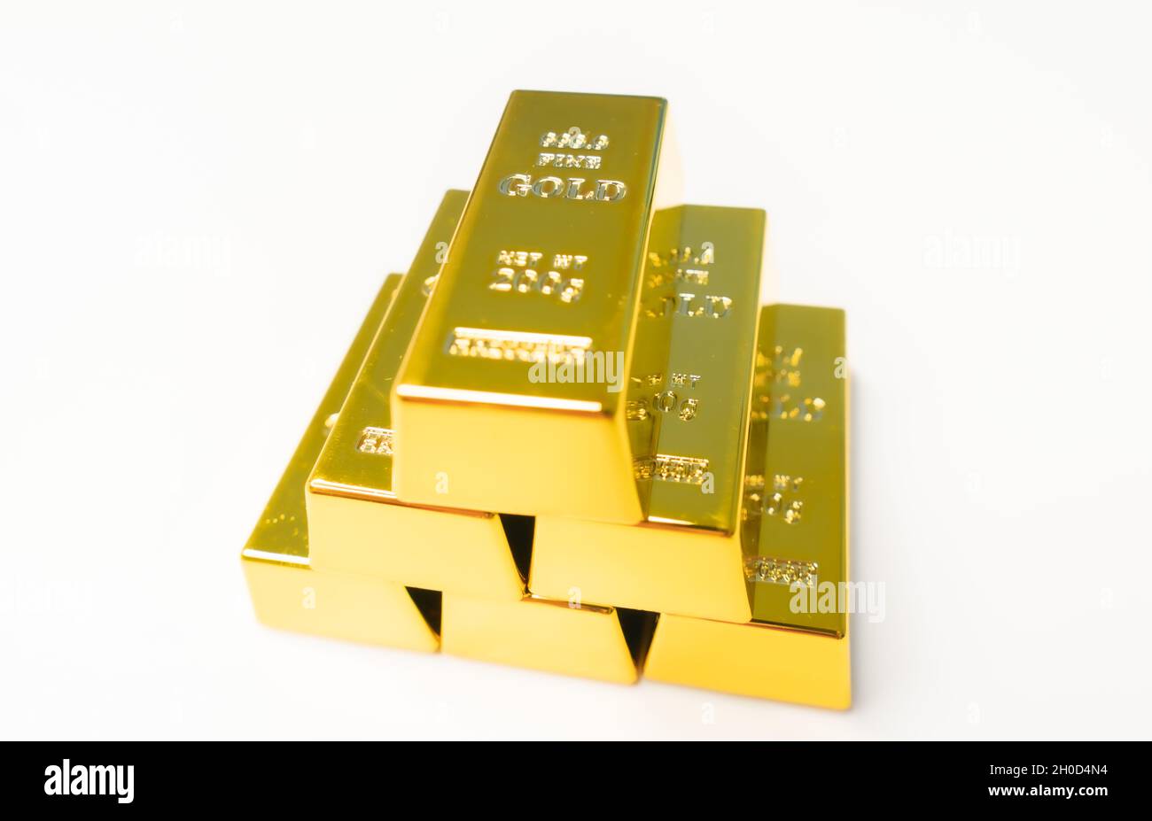 Stack of pure gold bullion bars in bank vault storage. 1kg 999,9 Fine Gold bar ingots background ...