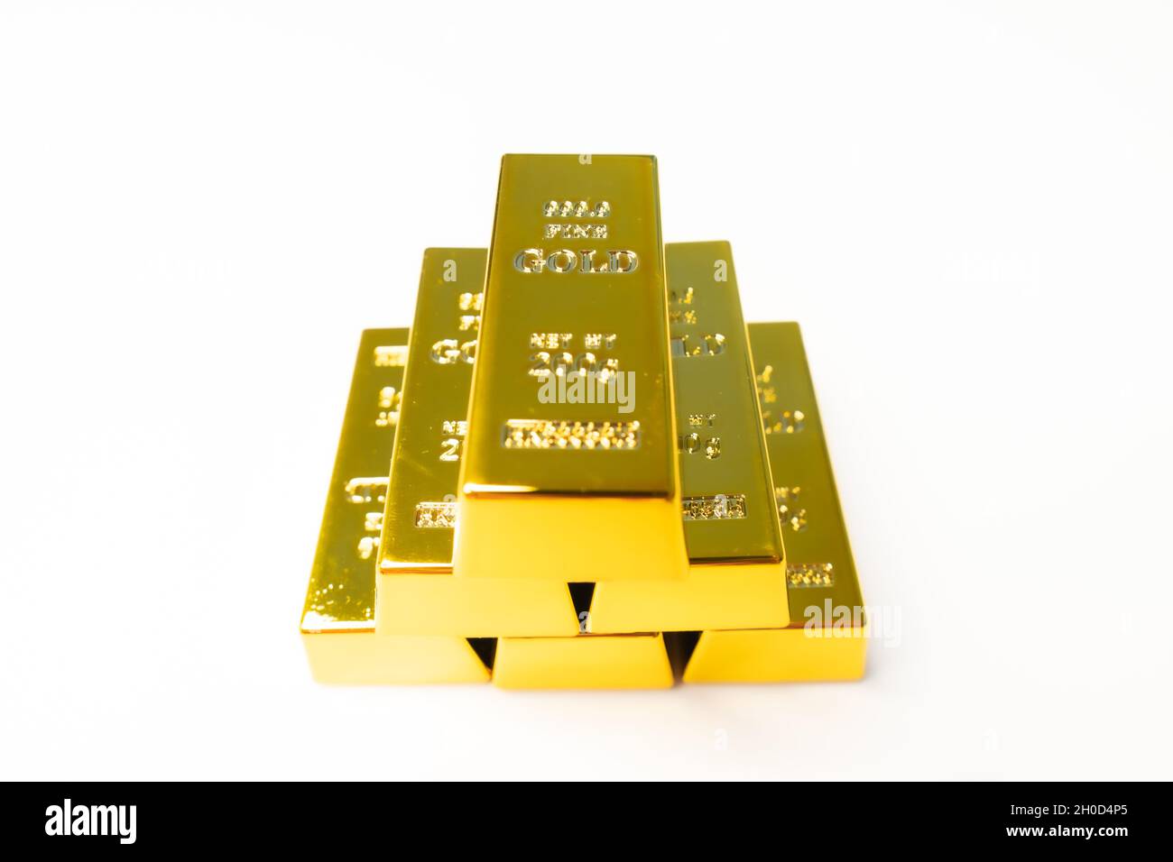 Stack of pure gold bullion bars in bank vault storage. 1kg 999,9 Fine Gold bar ingots background ...