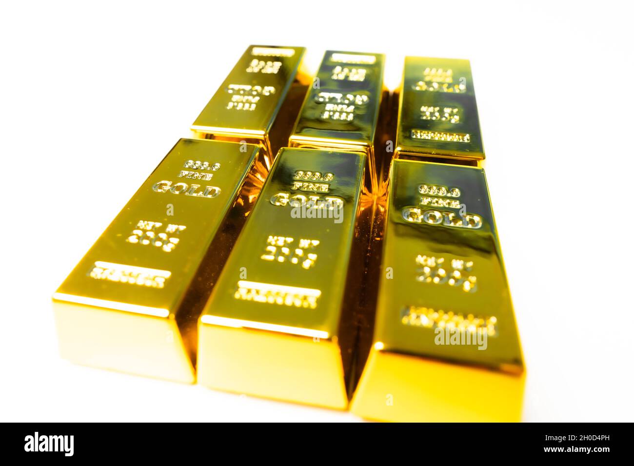 Stack of pure gold bullion bars in bank vault storage. 1kg 999,9 Fine Gold bar ingots background ...