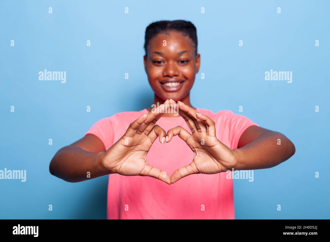 Showing love sign hi-res stock photography and images - Alamy