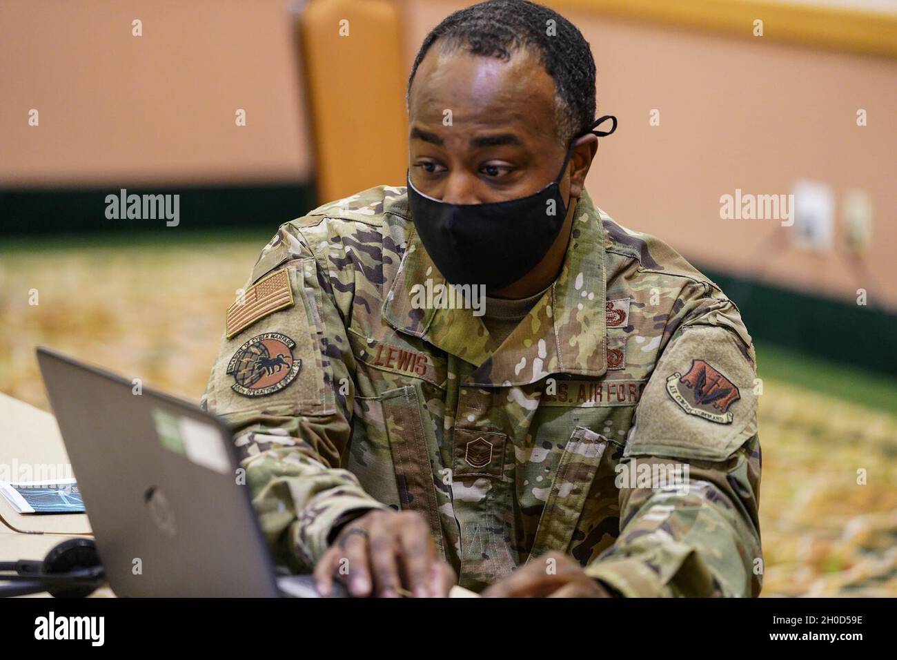Master Sgt. Alexander Lewis manages technology for the 688th Cyberspace ...