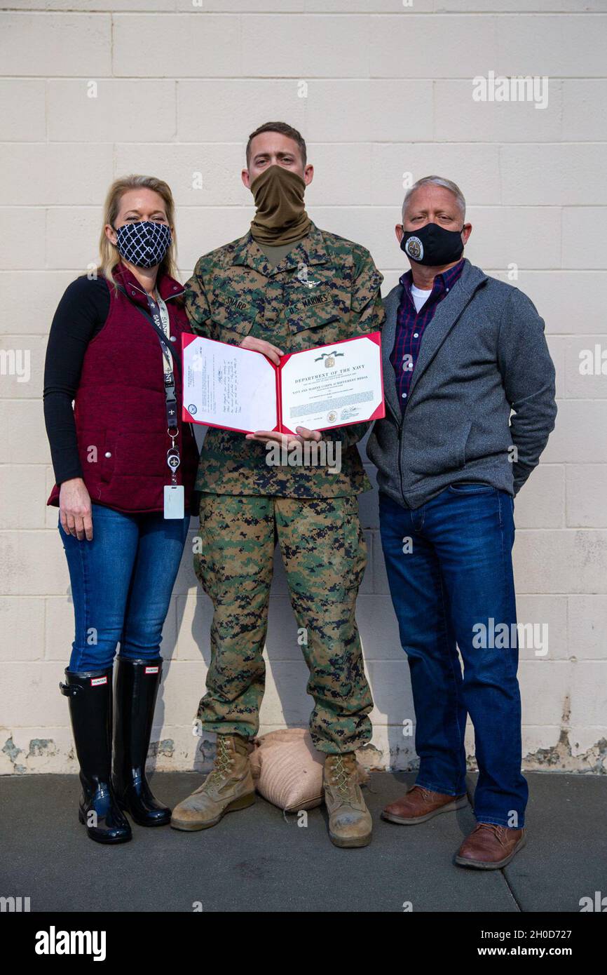 U.S. Marine Staff Sgt. Ryan Sharp, center, a quality assurance ...