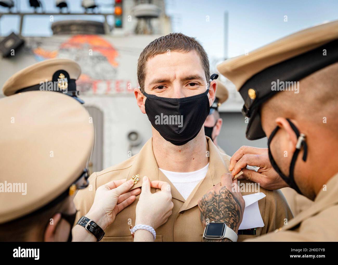 Chief Damage Controlman William Bullock, from Eatonton, Ga., receives ...