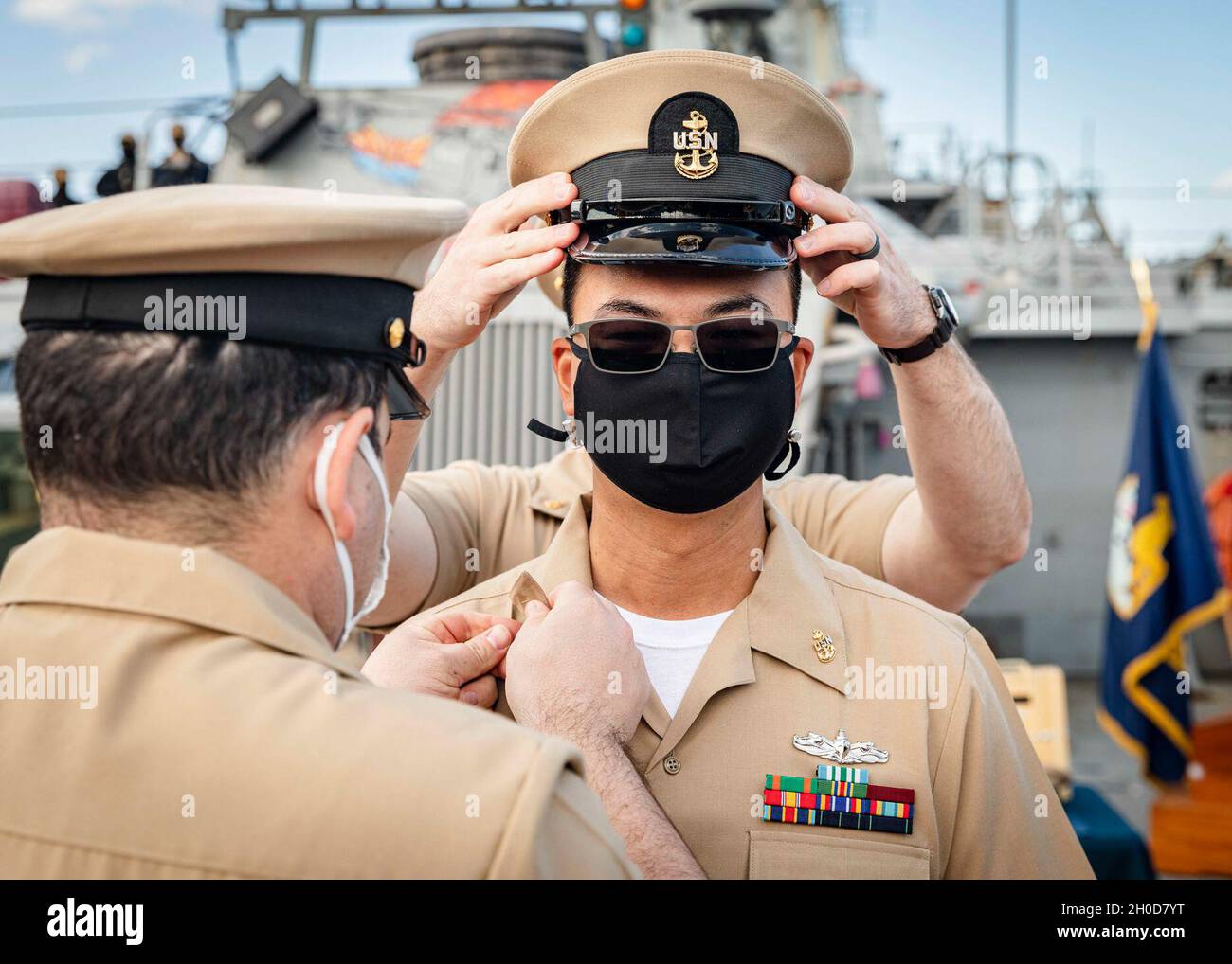 Chief Electronics Technician Edward Chow, from Philadelphia, receives his anchors and ...