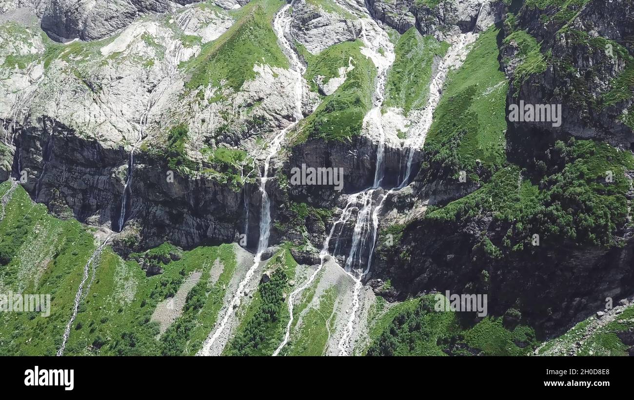 Waterfall flowing down from high mountains on a Sunny day. Top view of ...