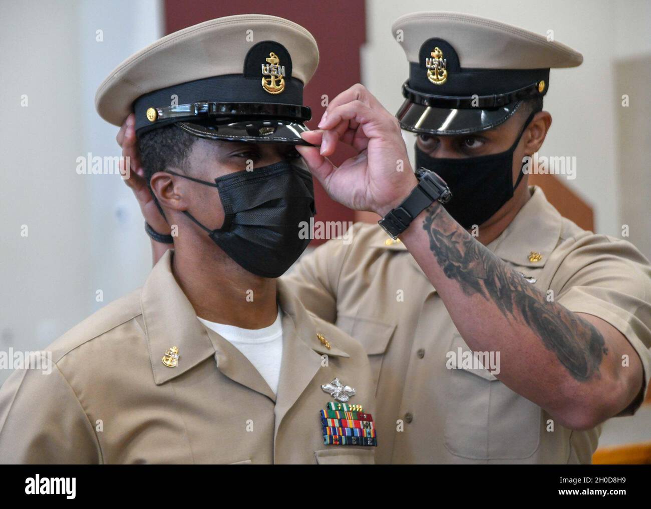 Newly-pinned HMC Shedrick Peters at the Chief's Pinning ceremony aboard ...