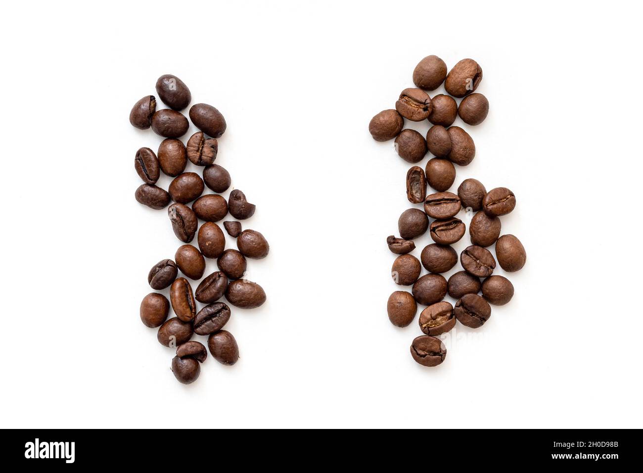 Two heaps of coffee grain Robusta and Arabica. Top view of roasted ...