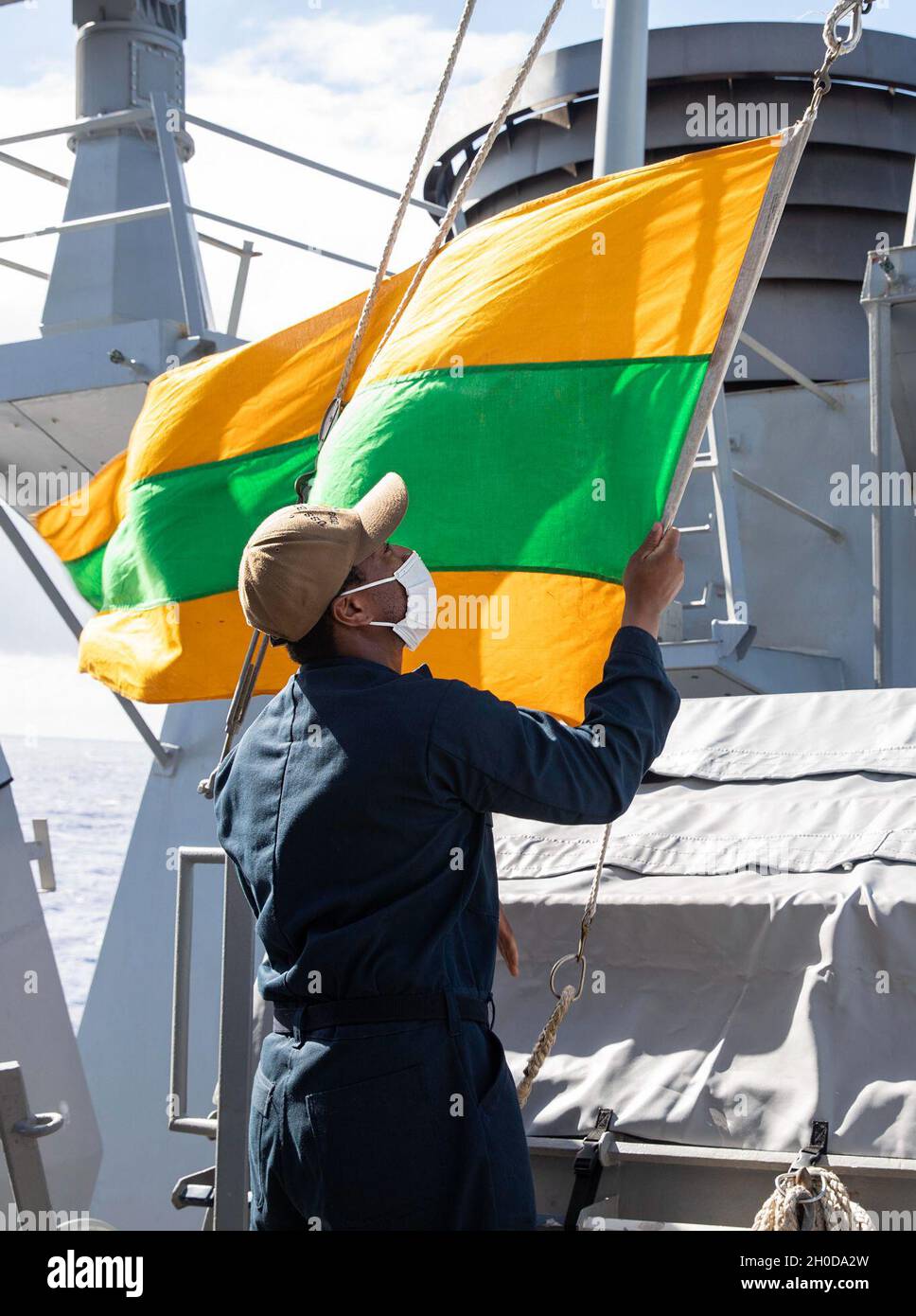 Quartermaster Seaman Olivier Dasilveira, from Aurora, Illinois, pulls ...