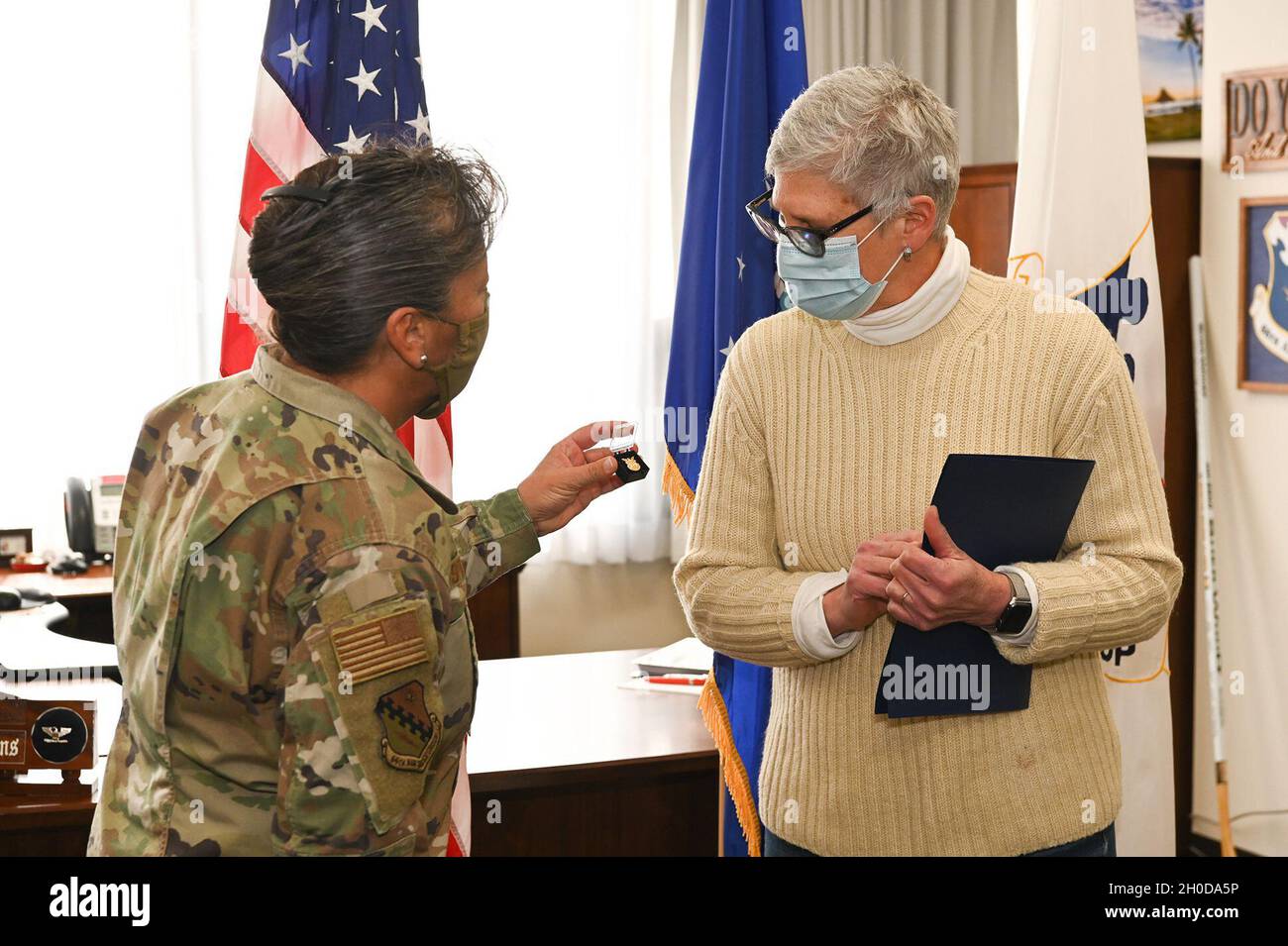 Col. Katrina Stephens, 66th Air Base Group commander, presents Carolyn ...