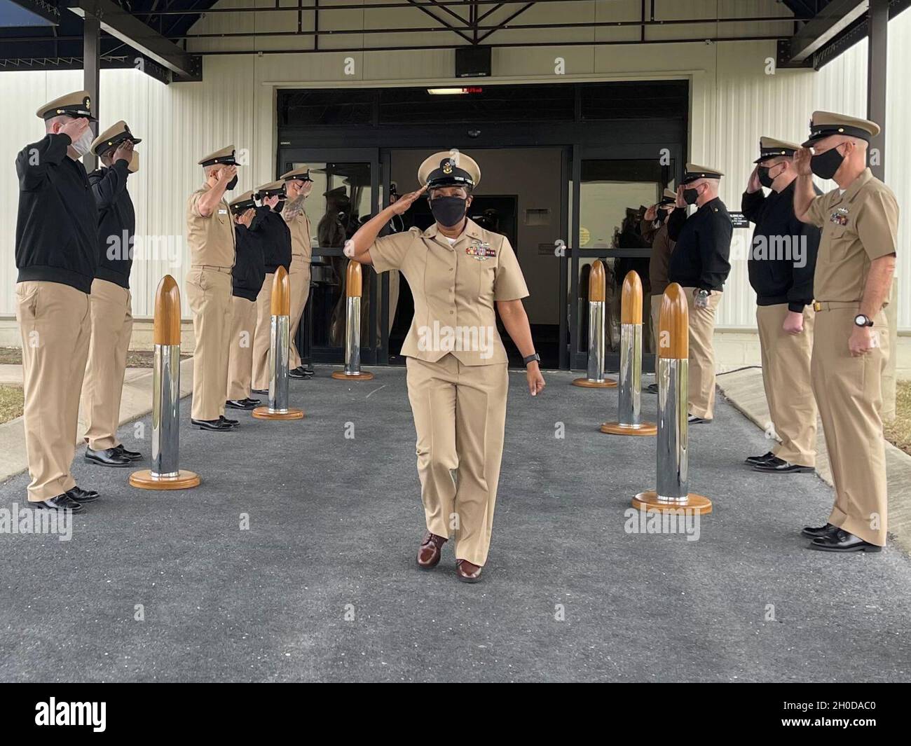 Chief Petty Officer DeWonna S. Singleton exits a chief petty officer pinning ceremony following ...