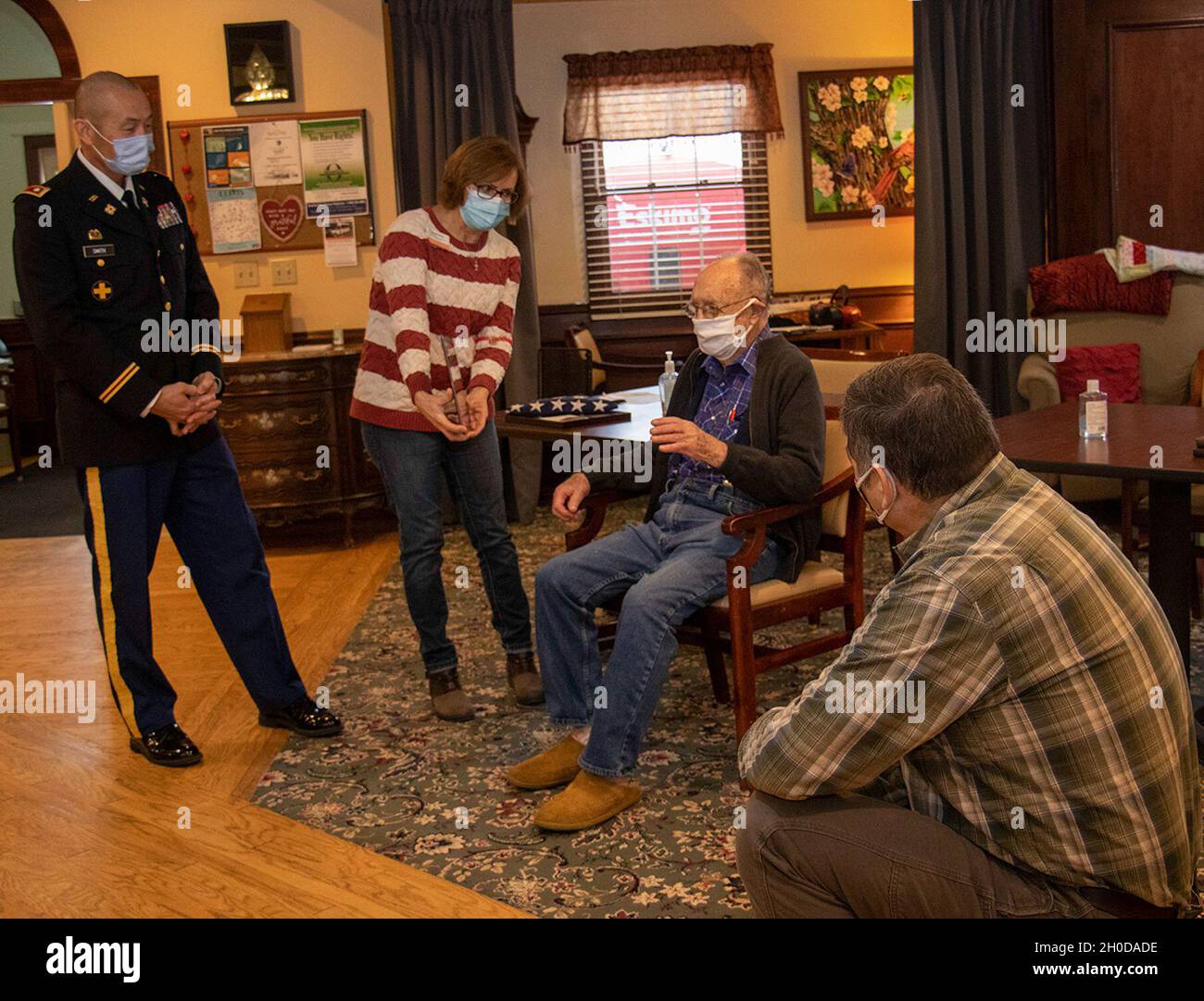 William Hills, of Freeport, Illinois, shows the U.S. flag and ...