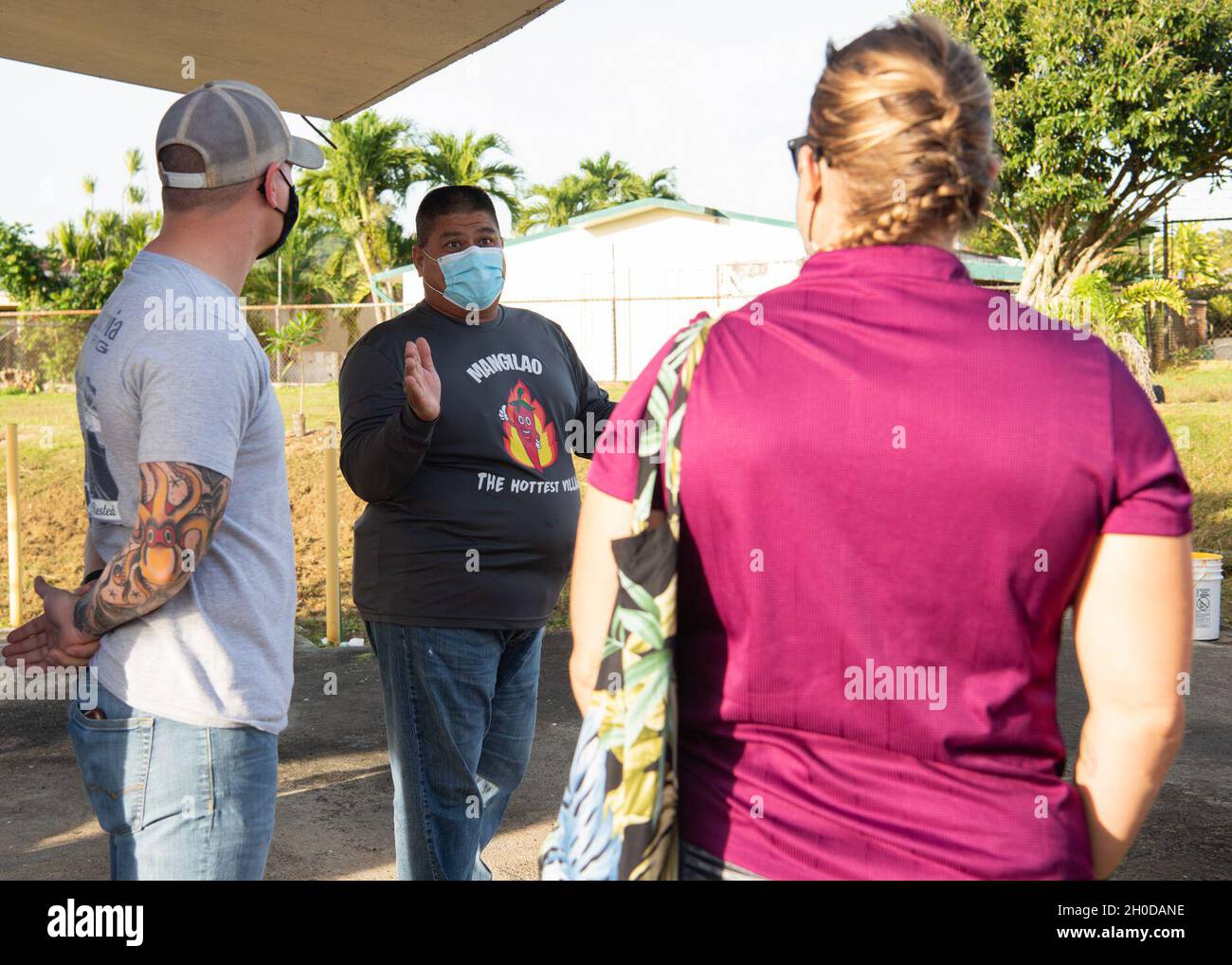 Allan Ungacta, Mangilao mayor, speaks with Lt. Col. Rebecca Heyse, 36th ...