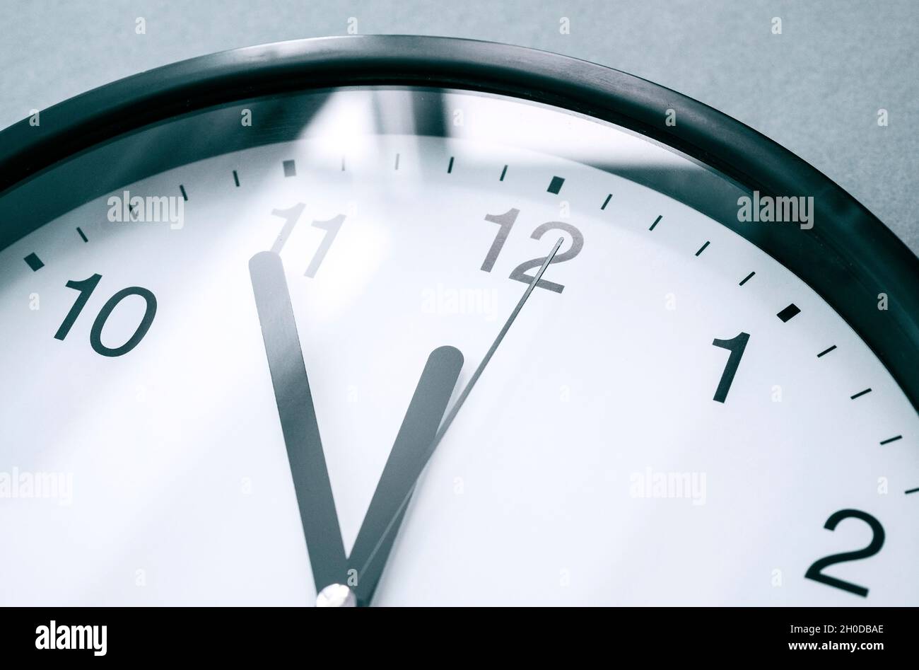 Close-up of clock face or dial with elegance black arrows and numbers ...
