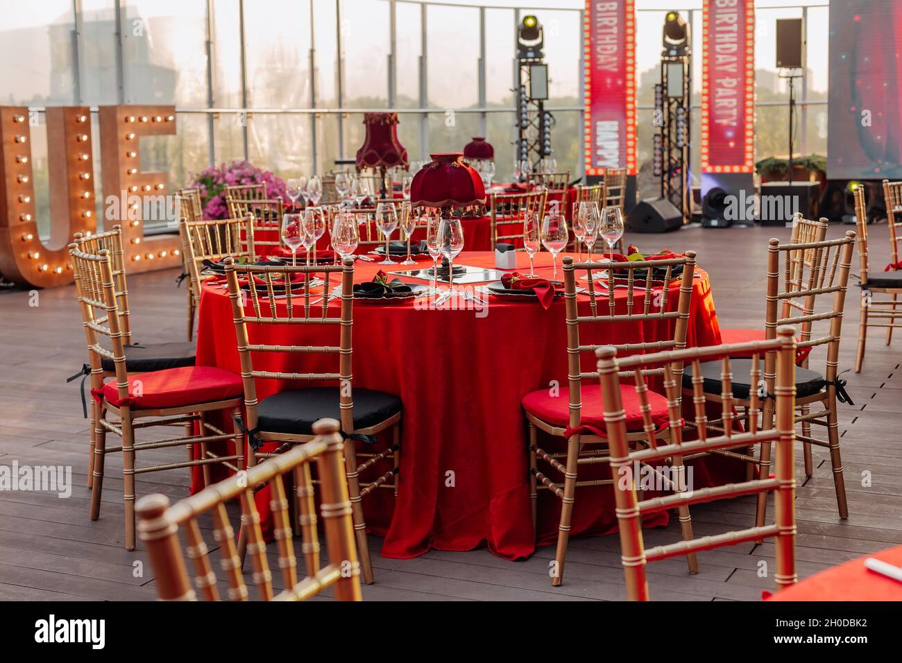 Guest's tables and chairs arrangement for banquet in black, red and ...
