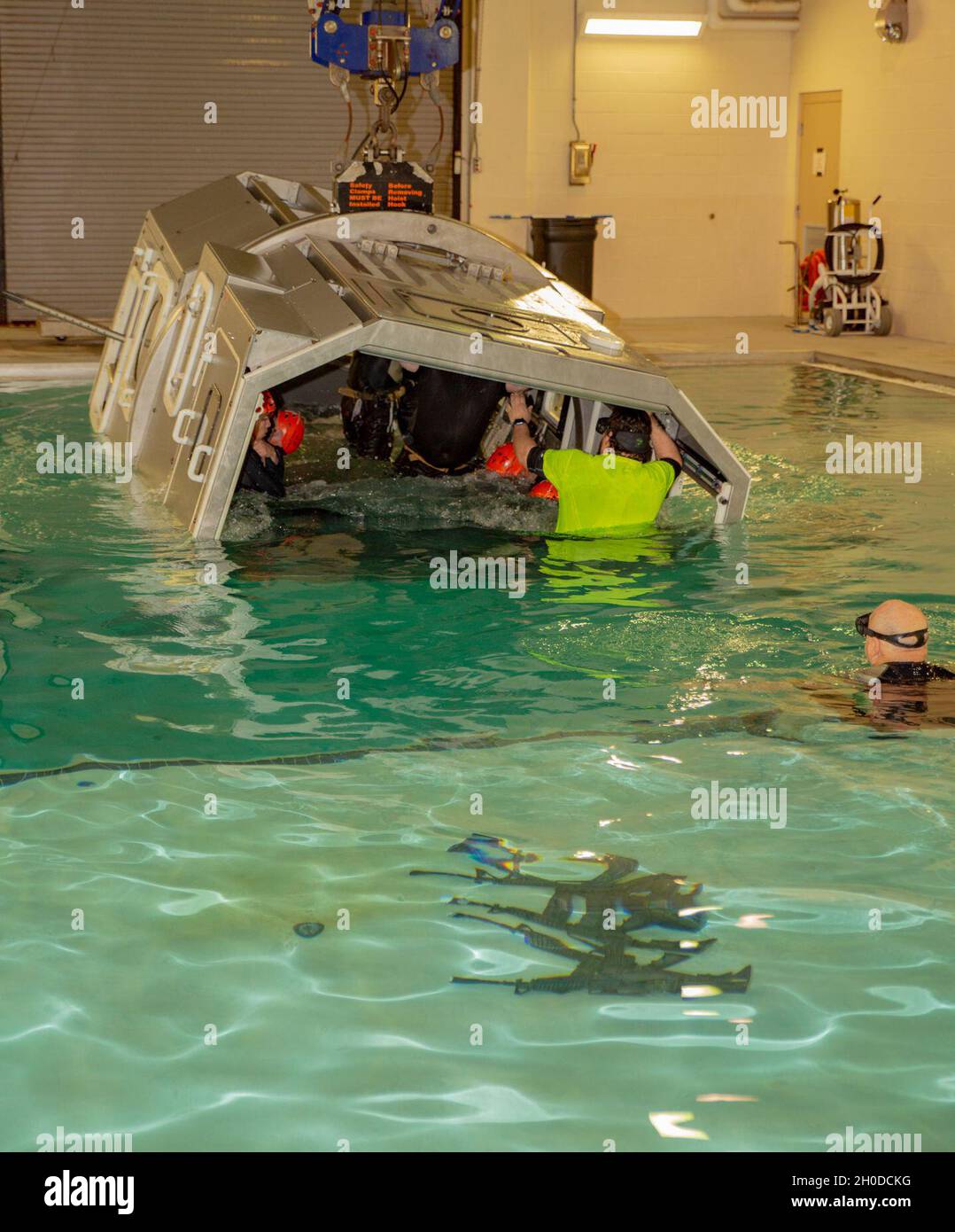 U.S. Marines prepare to escape the Modular Amphibious Egress Trainer ...