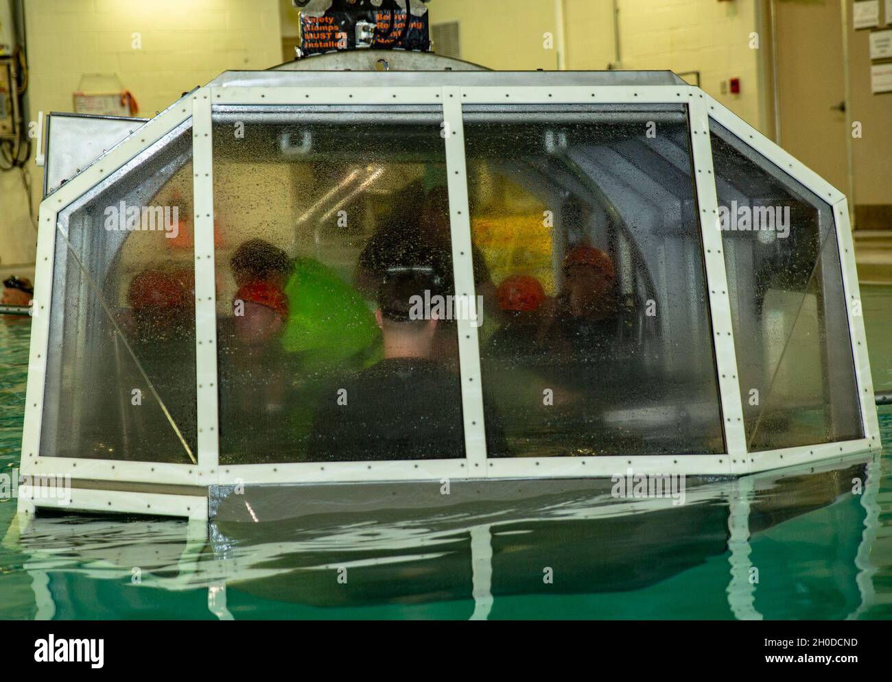 U.S. Marines prepare to escape the Modular Amphibious Egress Trainer ...