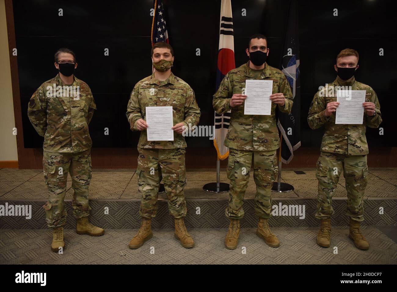 Colonel Jennifer Phelps stands with Airman 1st Class Anton Soloshenko ...