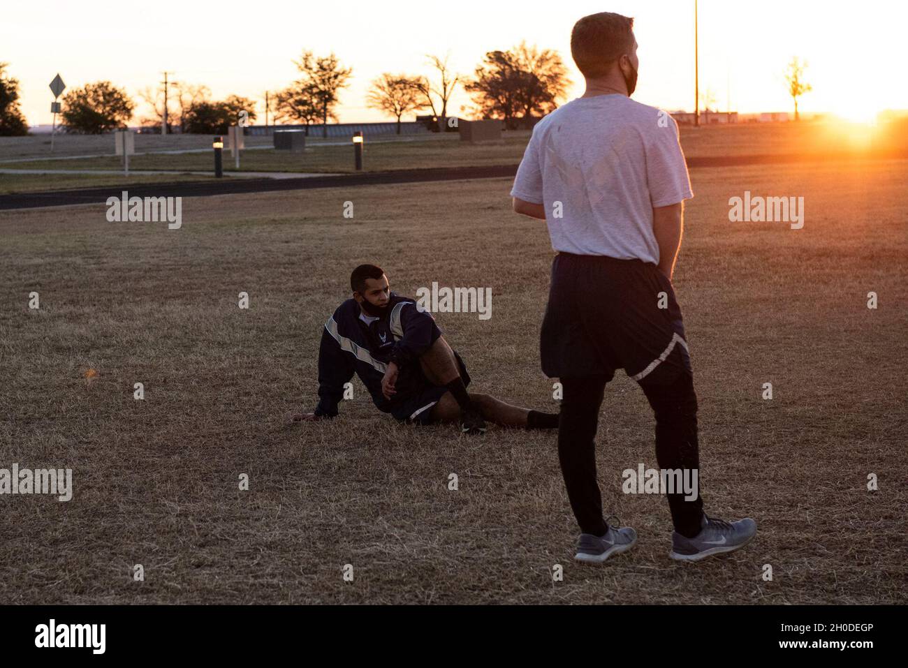 Student pilots stretches and recovers after an early morning workout on ...