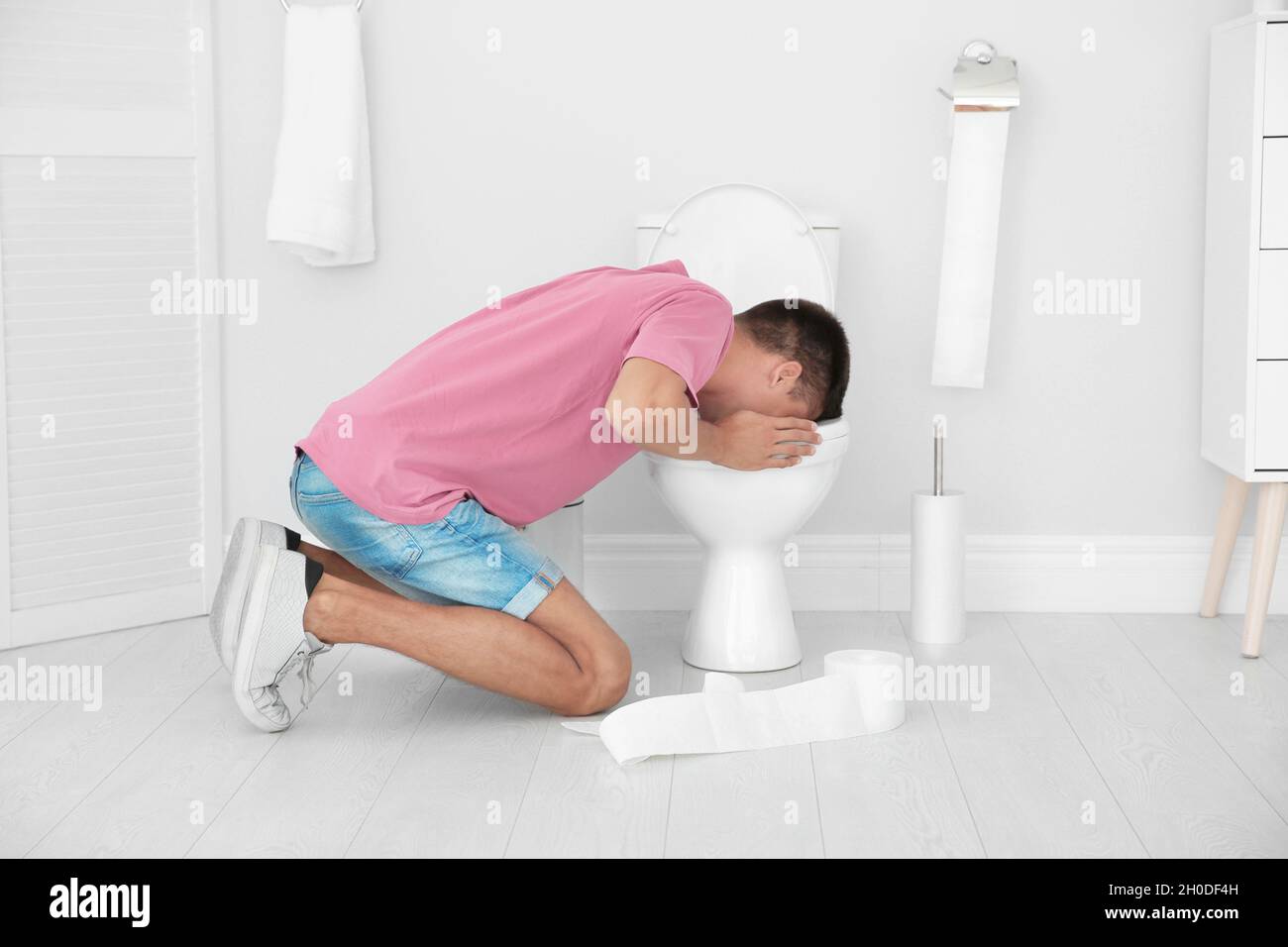 Young man drunk sick vomiting High Resolution Stock Photography and ...