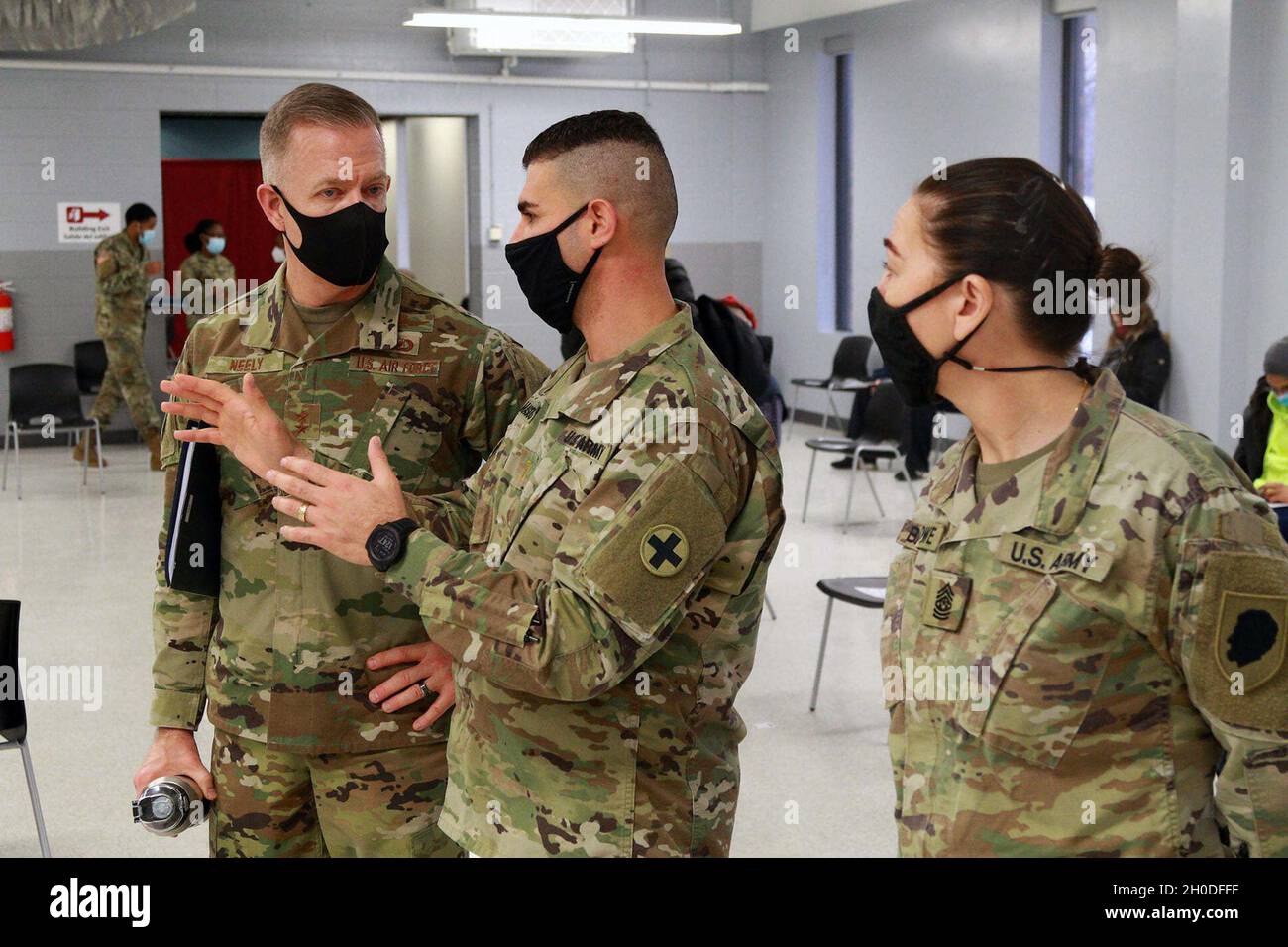 2nd Lt. Fahim Masoud, center, briefs Maj. Gen. Rich Neely, left, the ...