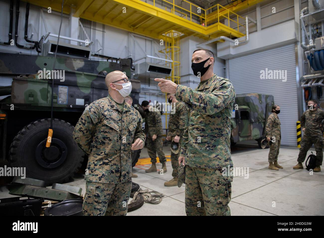 U.S. Marine Corps Gunnery Sgt. John Anderson, left, maintenance officer ...