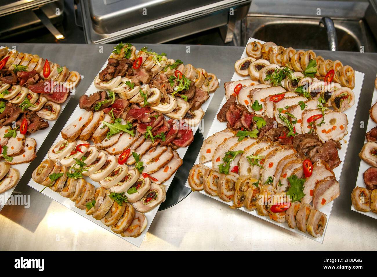 Slices of different types of meat on a wooden board Stock Photo - Alamy