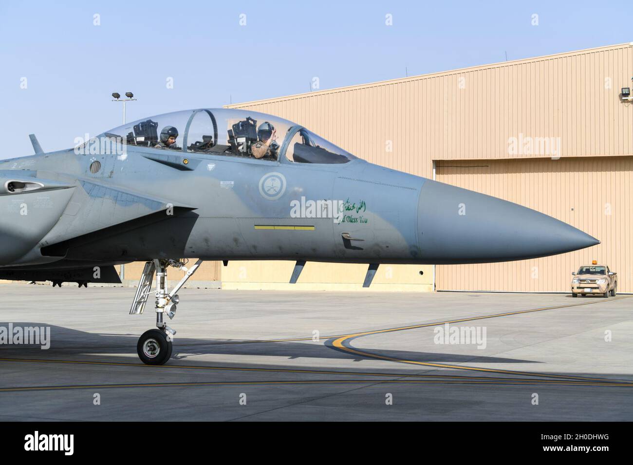 A Royal Saudi Air Force F-15 Eagle pilot waves while taxiing for take ...