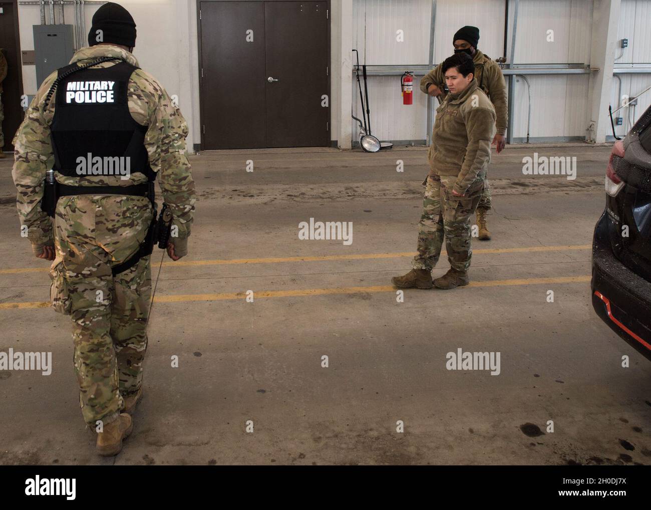 U.S. Army Spc. Derian Callwood, left, a 673 Security Forces Squadron ...