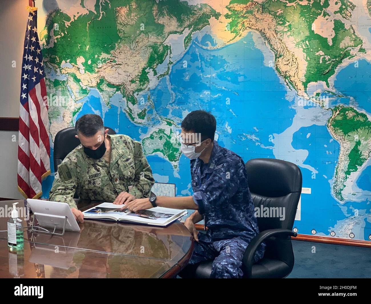 SINGAPORE (Feb. 2, 2021) – U.S. Navy Lt. Cmdr. Cory Eggers, left ...