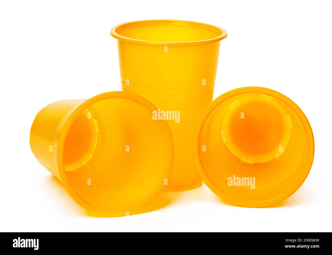 Pile of plastic cups on white background Stock Photo - Alamy