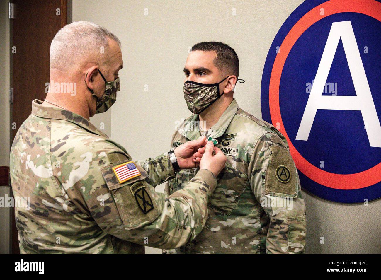 Command Sgt. Maj. Brian Hester, the USARCENT senior enlisted advisor, presented Staff Sgt. (P ...