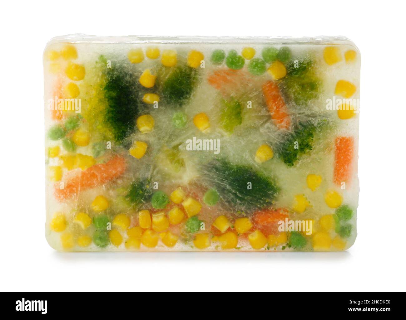 Fresh vegetables frozen in ice cube on white background Stock Photo - Alamy