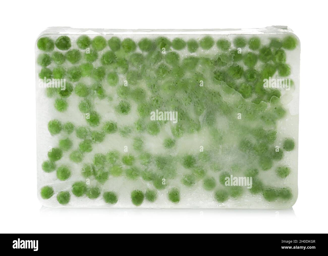 Green peas in ice cube on white background. Frozen vegetables Stock ...