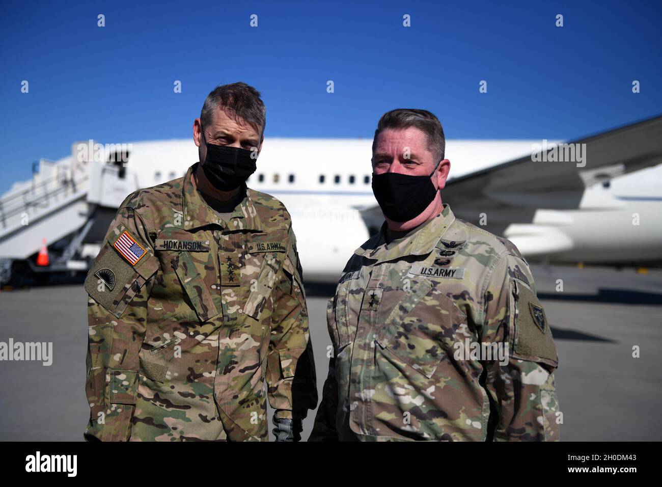 Army Gen. Daniel Hokanson, chief, National Guard Bureau, talks with ...