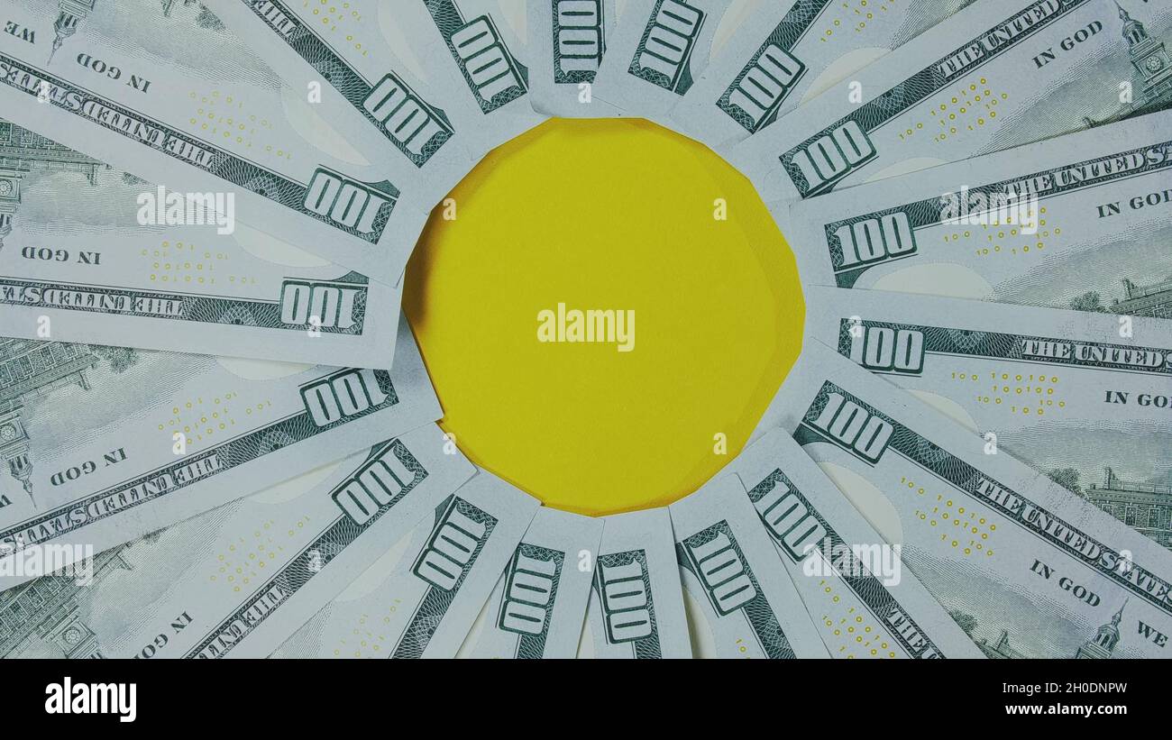 Many dollar are arranged around the edges of the image as a frame ...