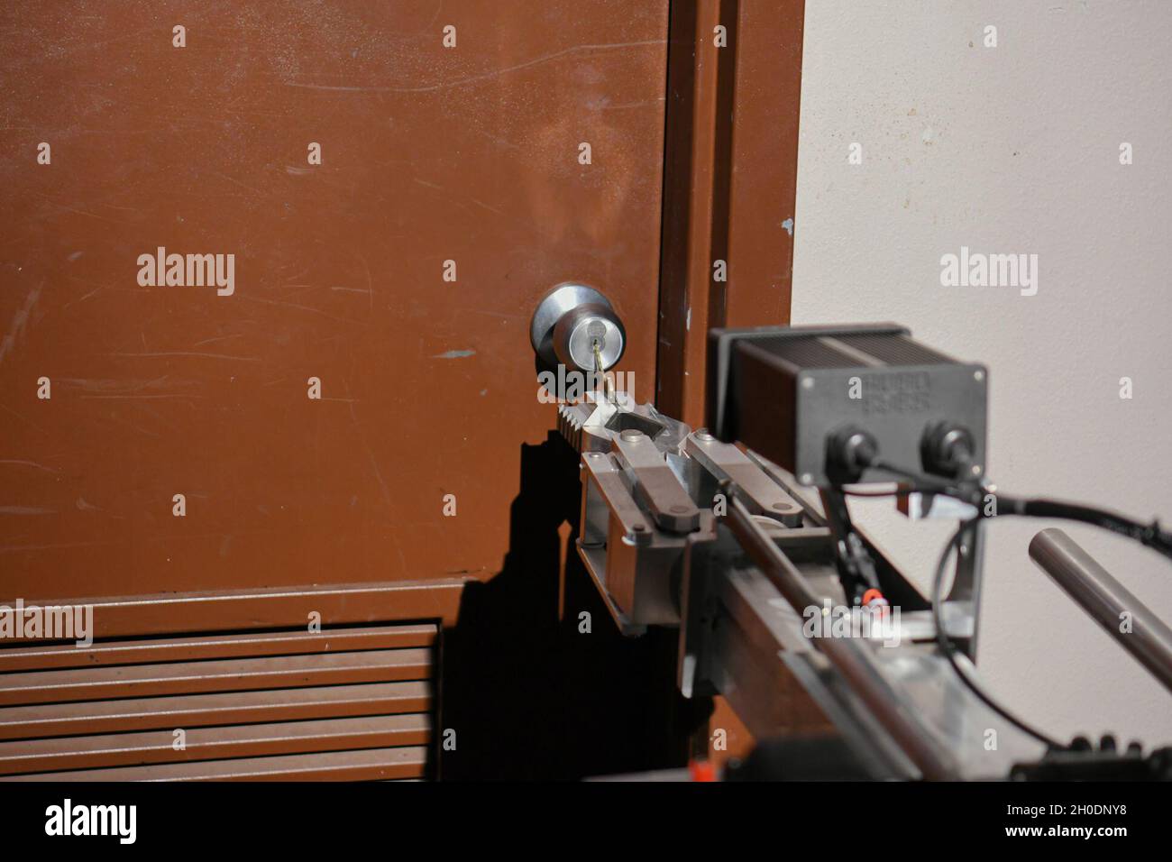 An F6 robot inserts a key into the door lock on Dyess Air Force Base ...