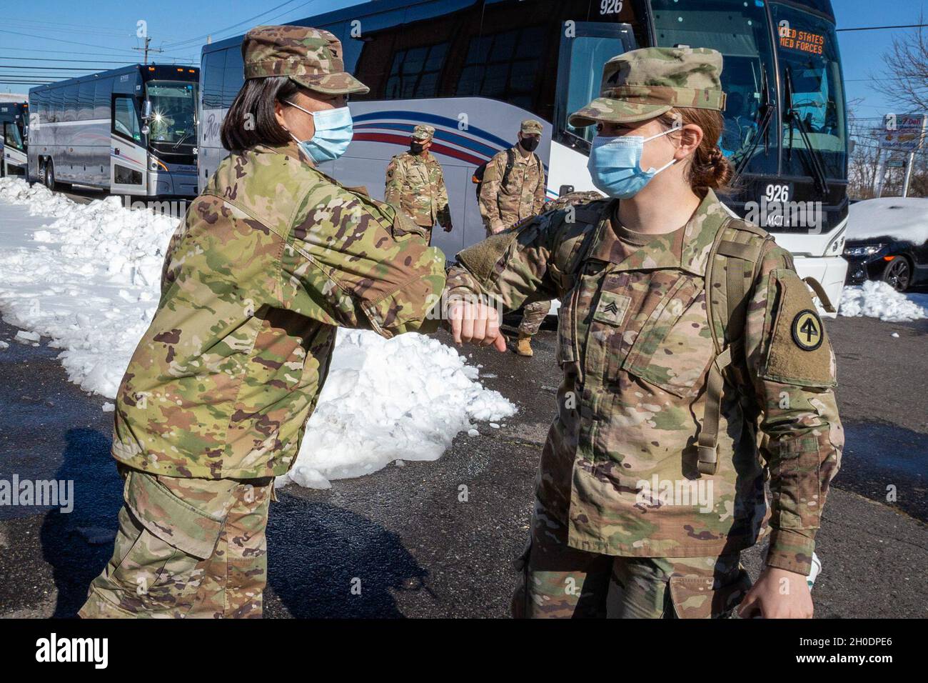 Col. Lisa J. Hou D.O., left, Interim Adjutant General, bumps elbows ...