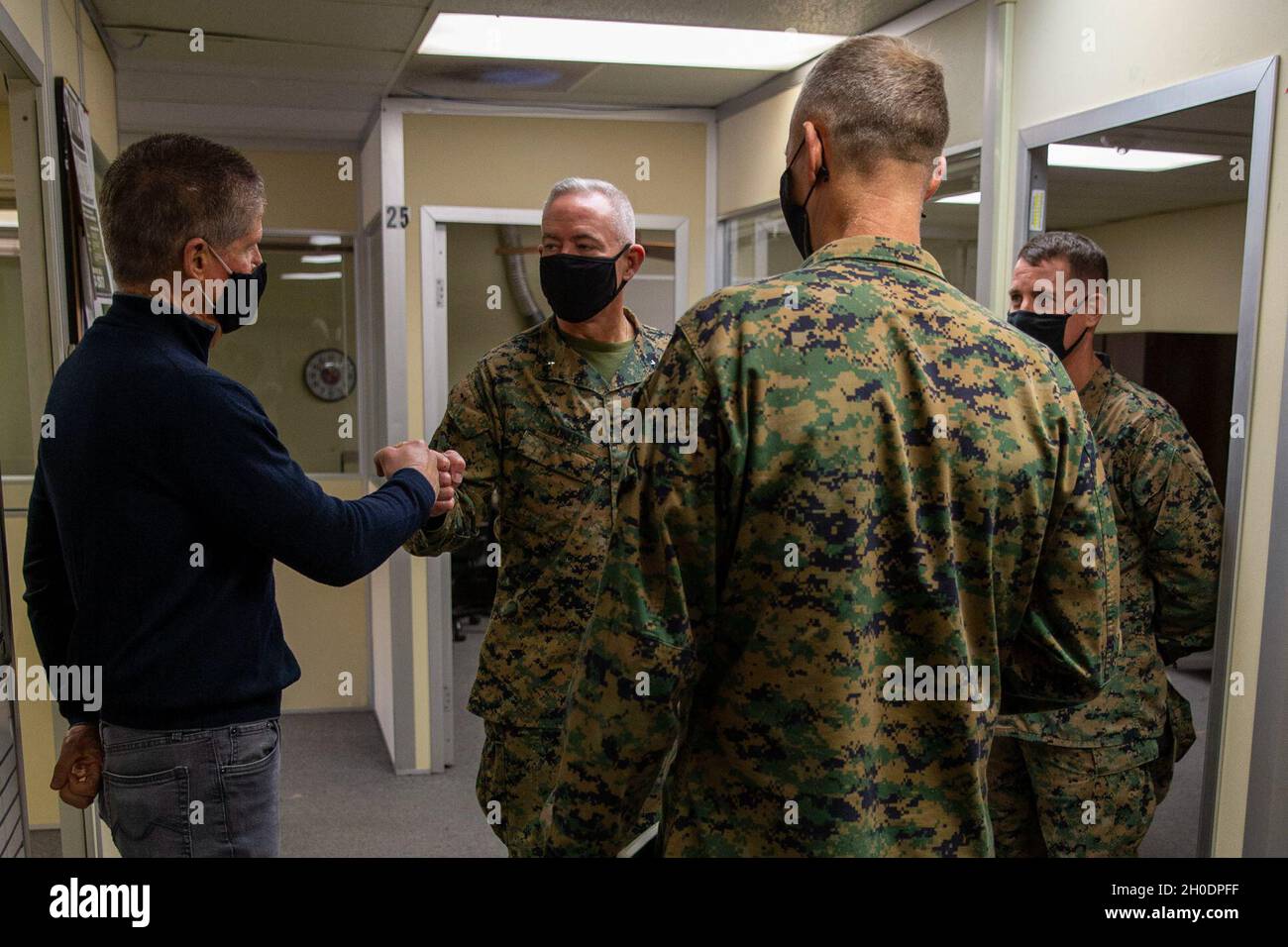 U.S. Marine Brig. Gen. Dan Conley, center, the commanding general of ...
