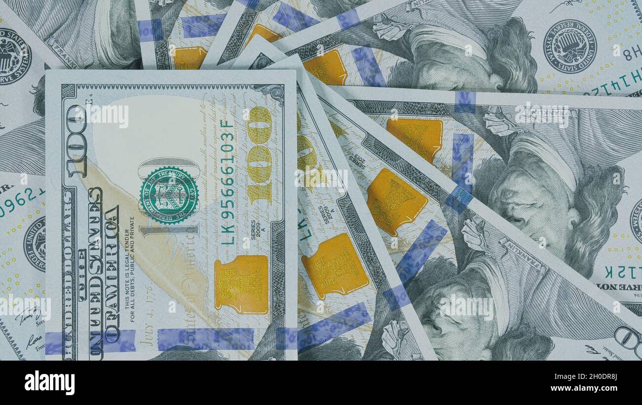 Many dollar are arranged around the edges of the image as a frame ...