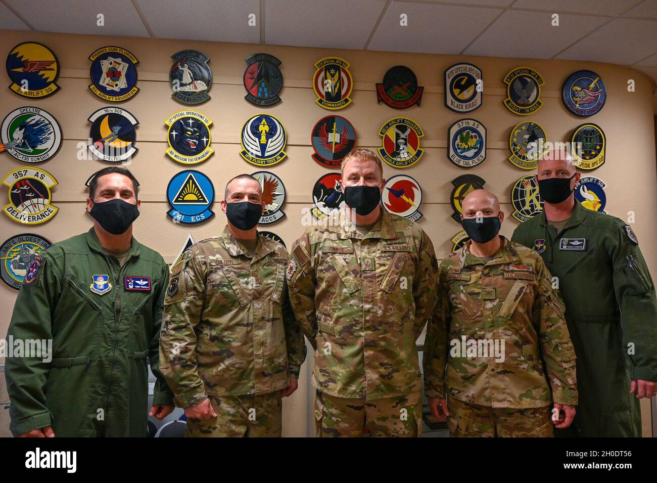 Master Sgt. Kyle Harris, 714th Training Squadron flight chief, center ...