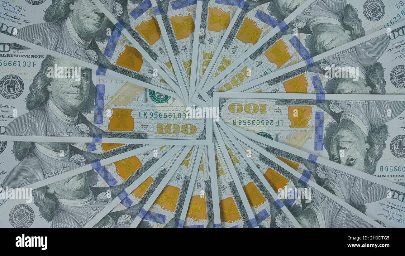 Many dollar are arranged around the edges of the image as a frame ...