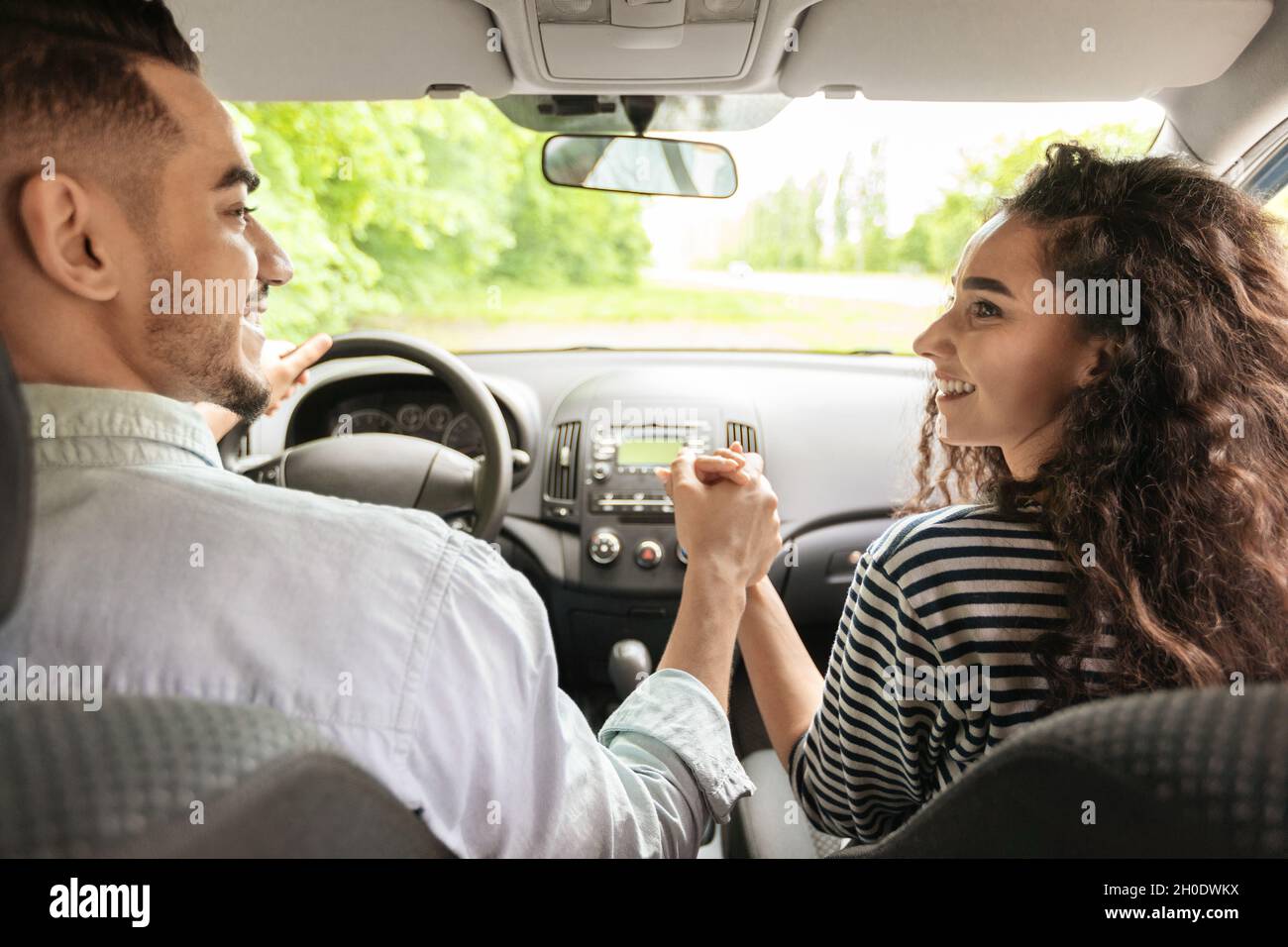 Couple driving car back view hi-res stock photography and images - Alamy